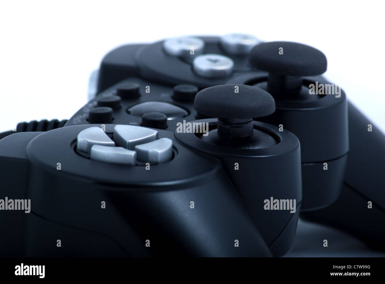 Closeup of black game console controller on white background Stock ...