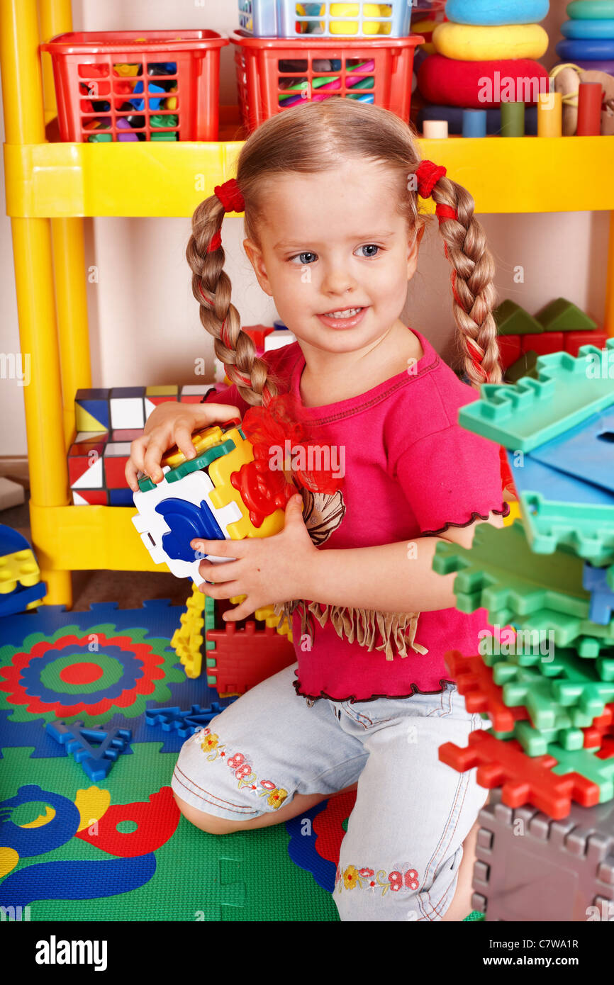Little girl playing block and construction set in preschool Stock Photo ...