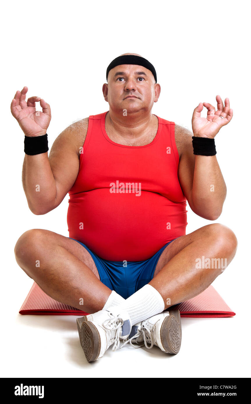 Large fitness man doing yoga exercises isolated in white Stock Photo ...