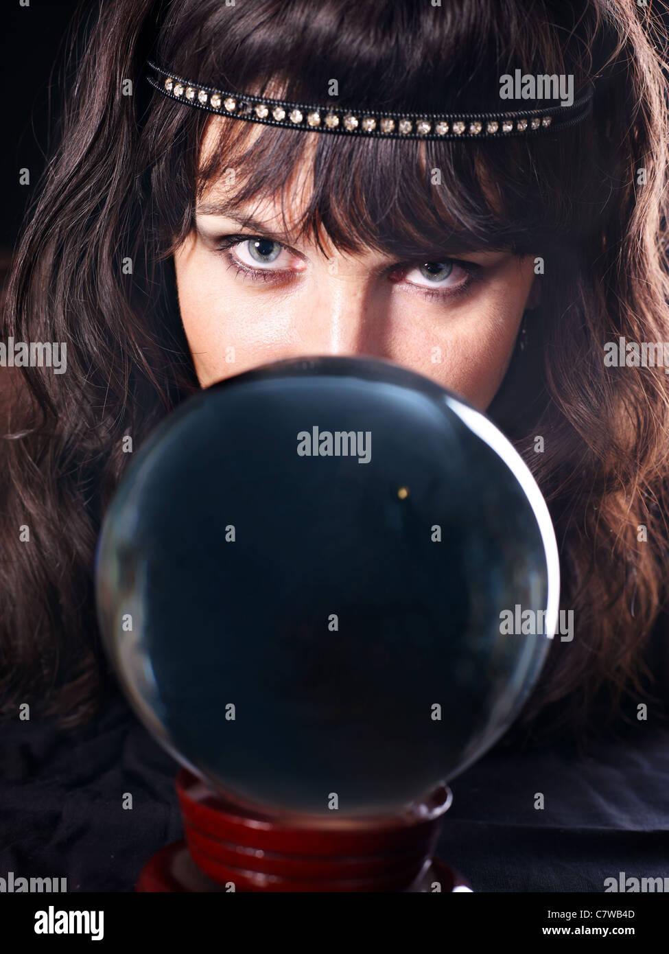 Young woman with crystal ball. Beauty and fashion Stock Photo - Alamy
