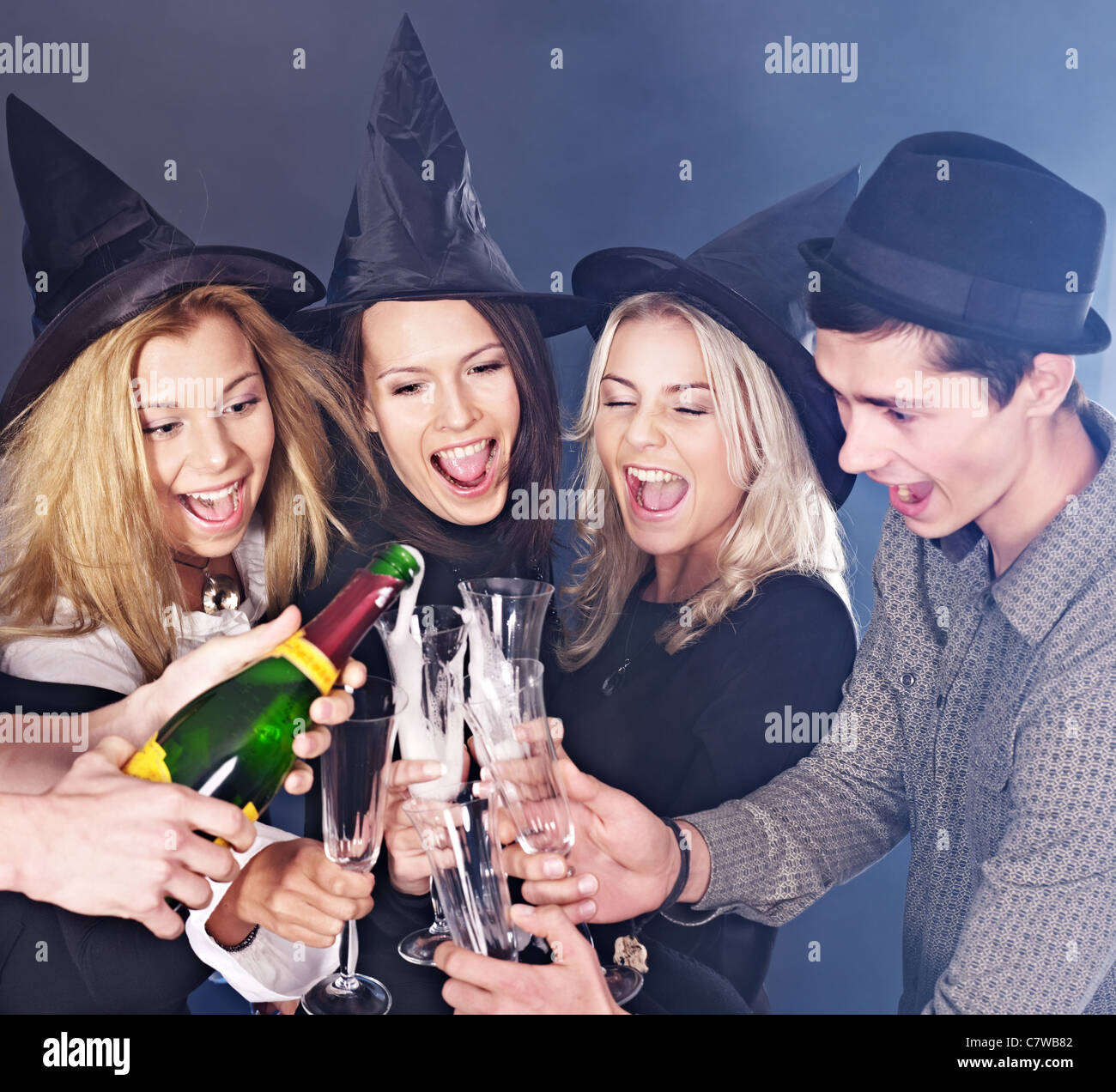 Group people at nightclub drinking champagne. Halloween Stock Photo - Alamy