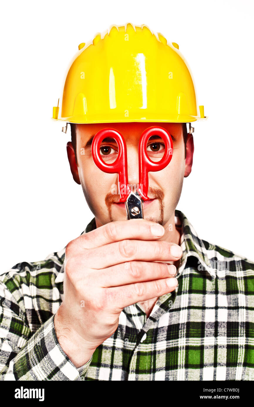fun portrait of young manual worker joke with his tool Stock Photo - Alamy