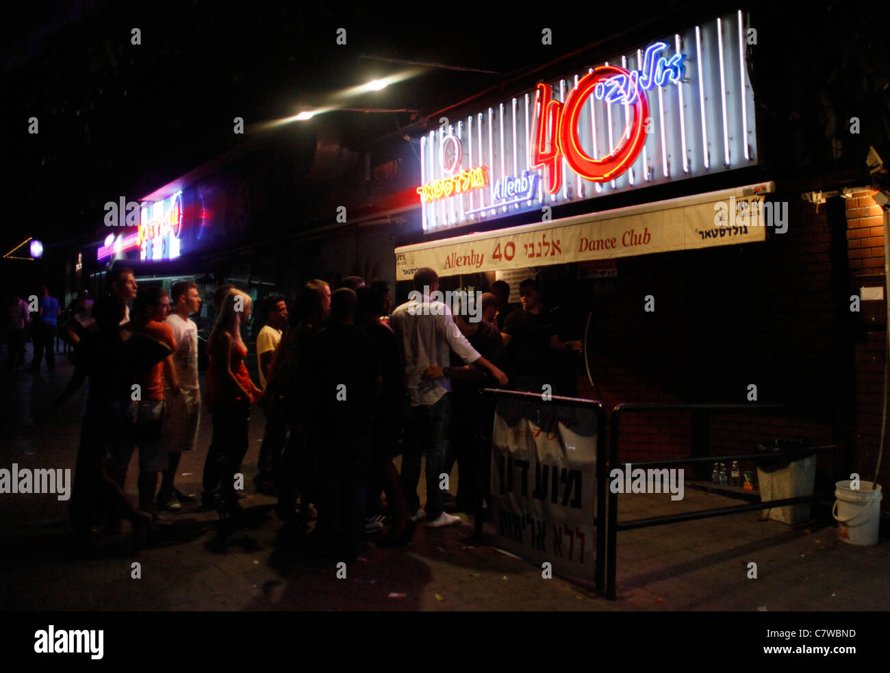 Young revelers being checked up before entering a night club in Allenby ...