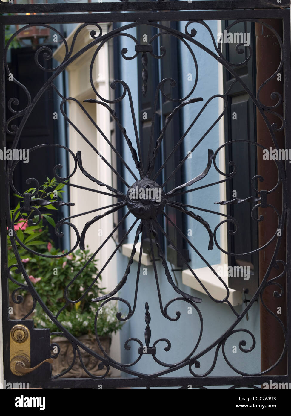 Iron gate in front of a colorful Georgian Row House on Rainbow Row in ...