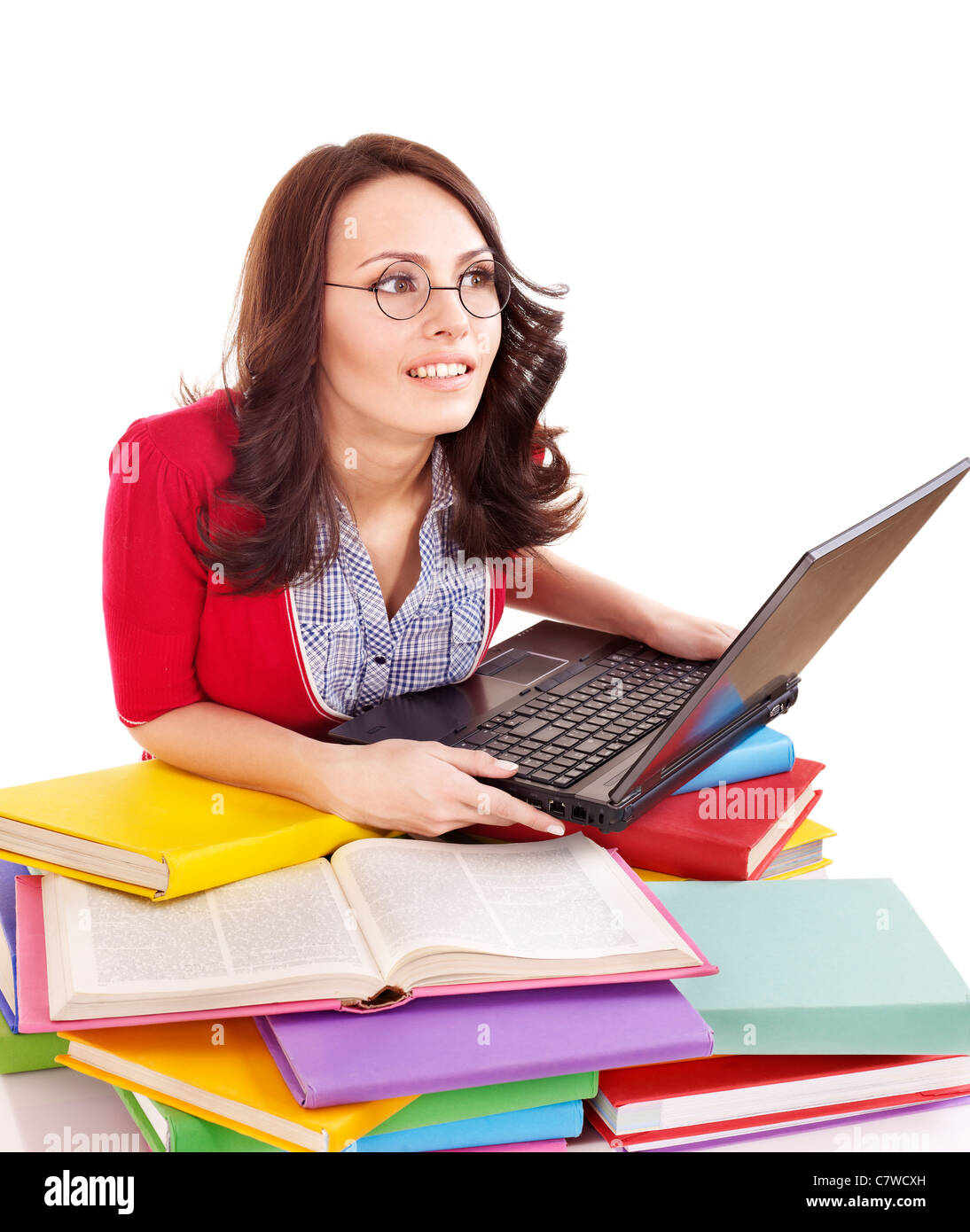 Girl with stack color book and laptop Stock Photo - Alamy