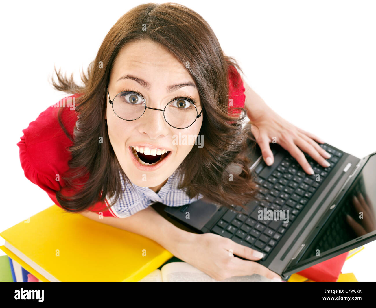 Girl with stack color book and laptop Stock Photo - Alamy
