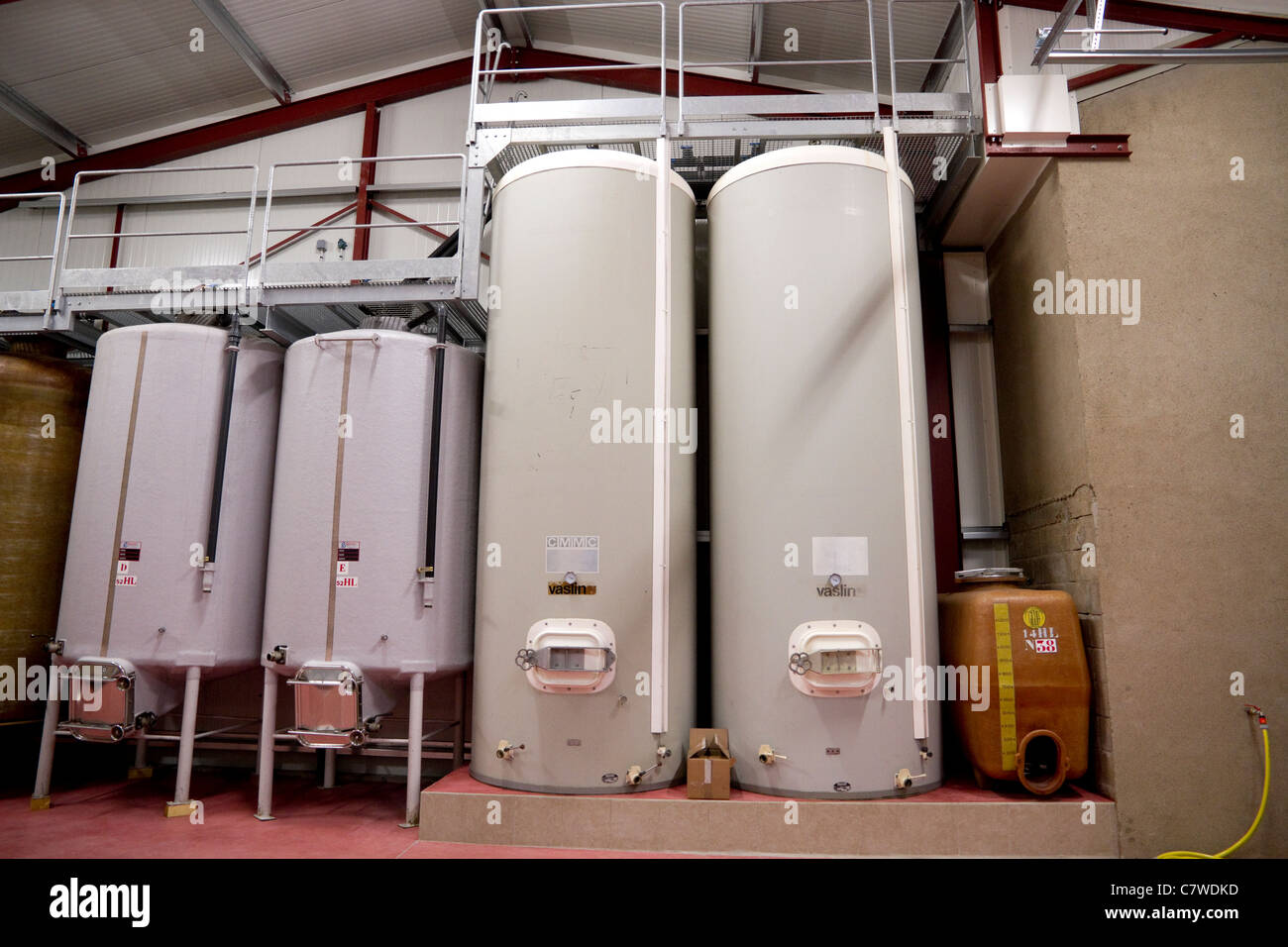 Wine-maker's cellar or cave with storage or processing tanks in France ...