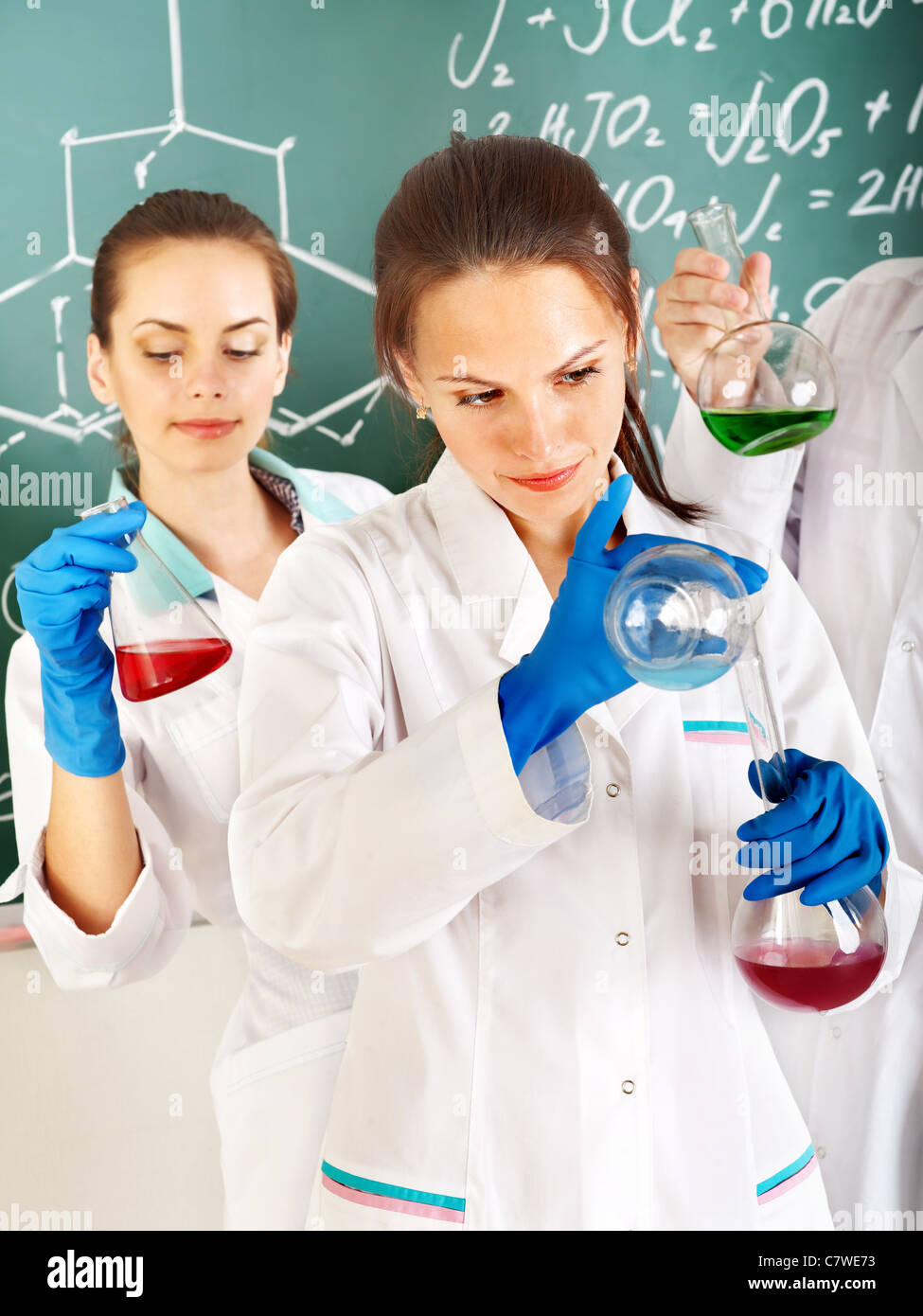 Group chemistry student with flask in classroom Stock Photo - Alamy