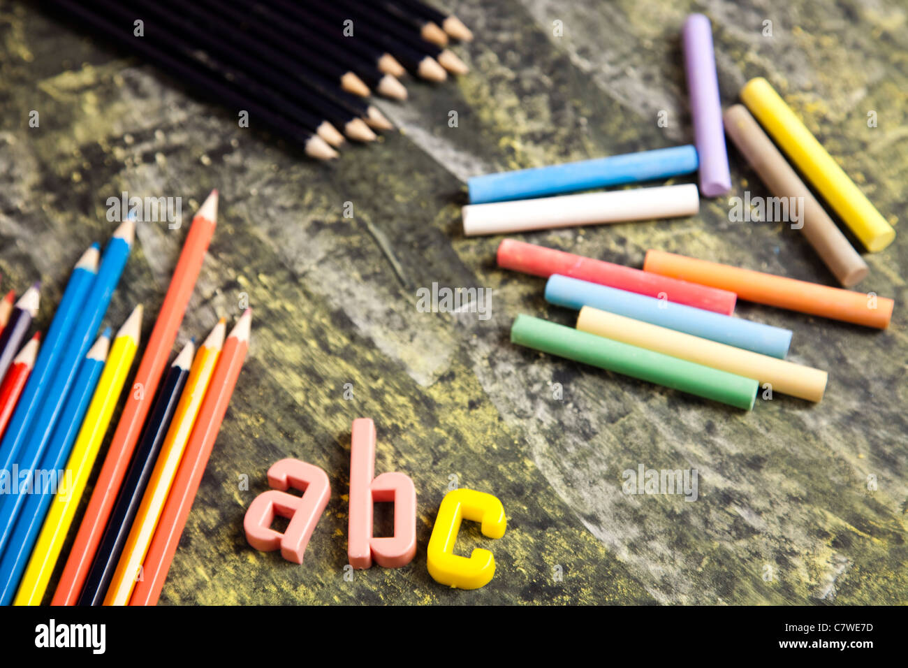 Colour pencils & Chalkboard Stock Photo - Alamy