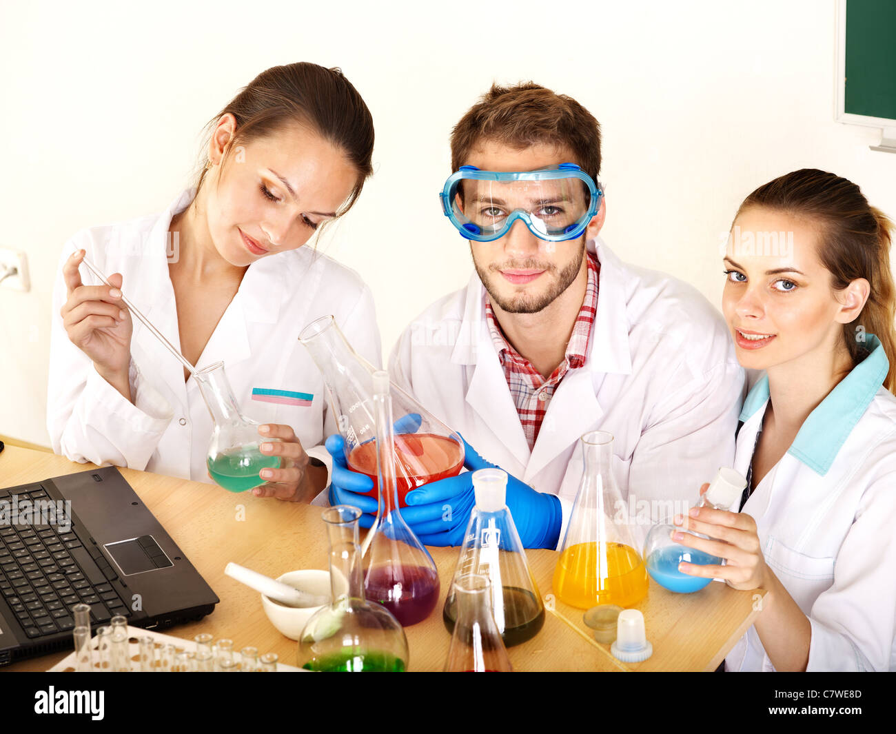 Group chemistry student with flask in classroom Stock Photo - Alamy