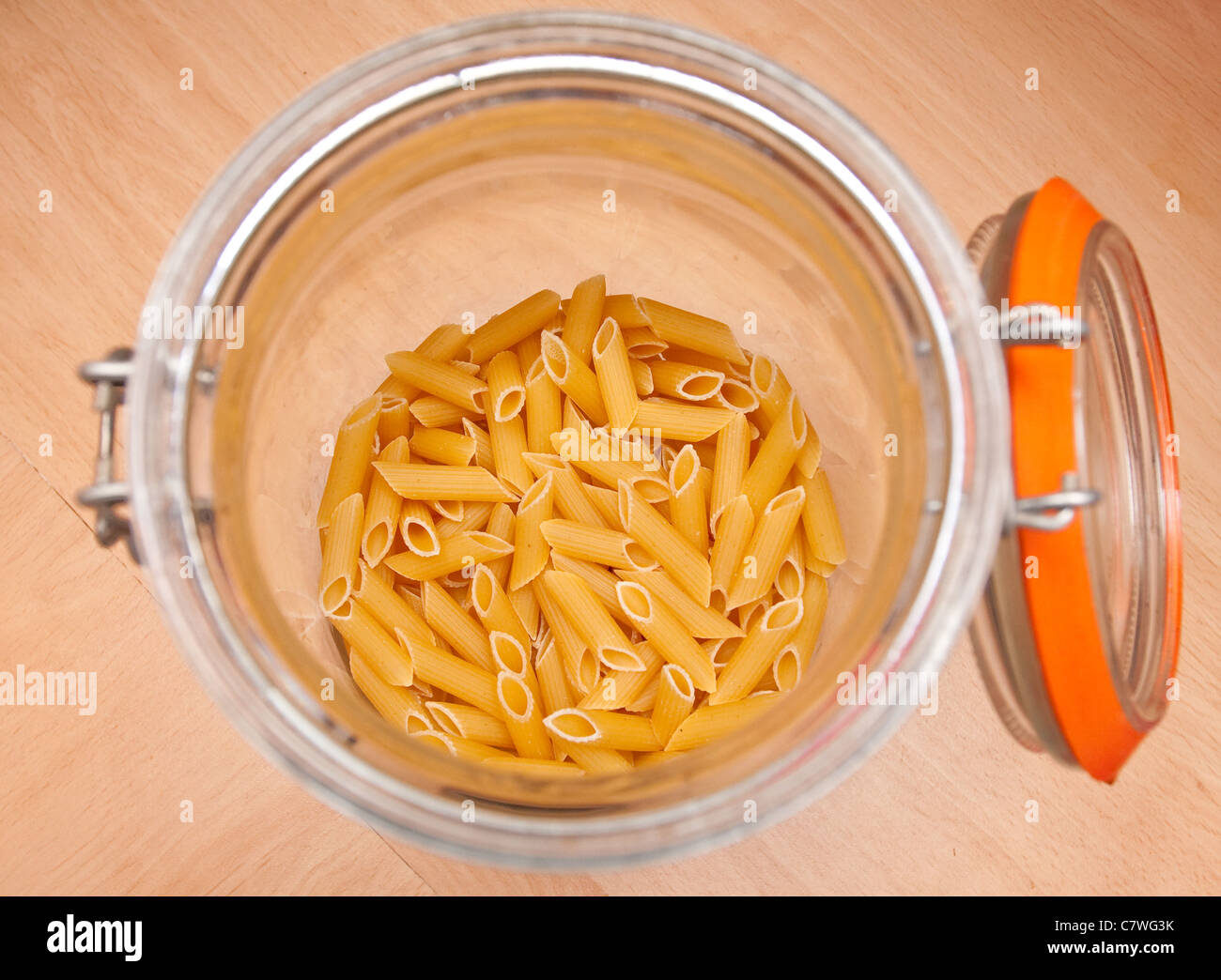 Dry penne pasta in a glass jar Stock Photo - Alamy