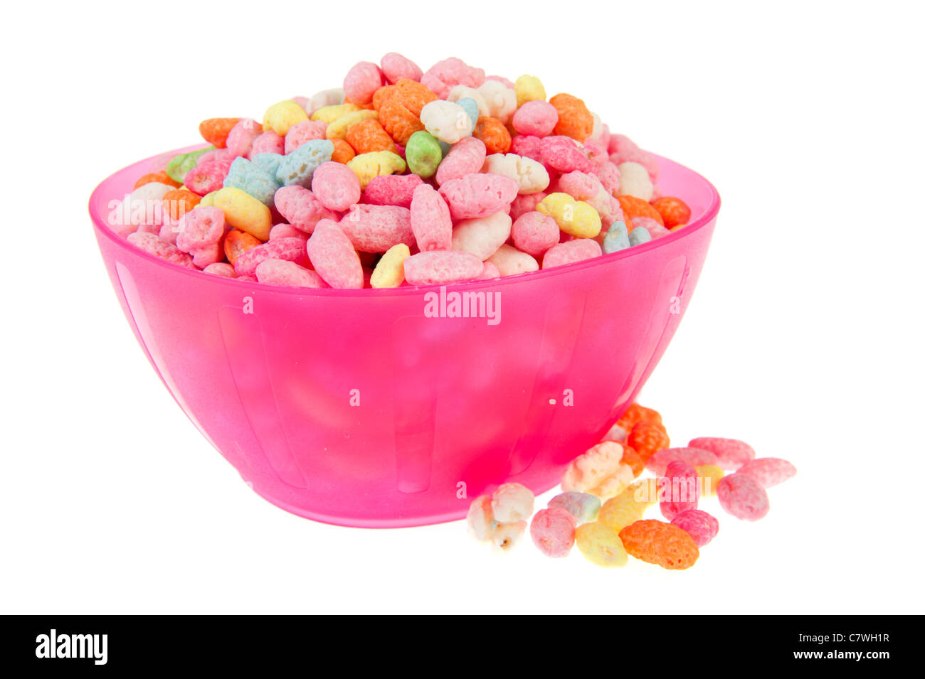 Pink plastic bowl with colorful sweets isolated over white background ...