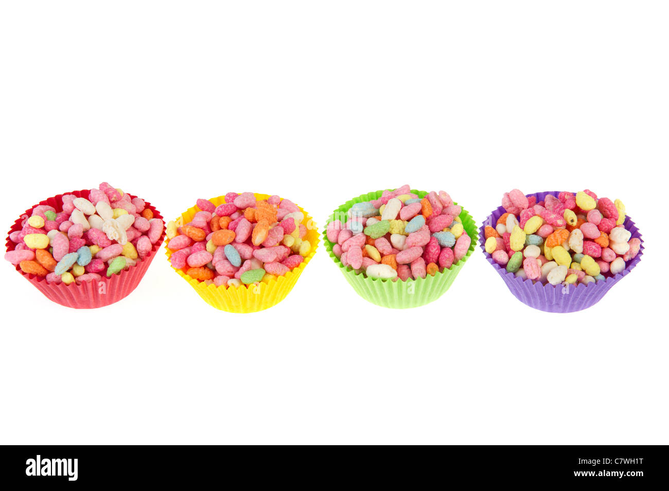 Colorful sweets in cups isolated over white background Stock Photo - Alamy