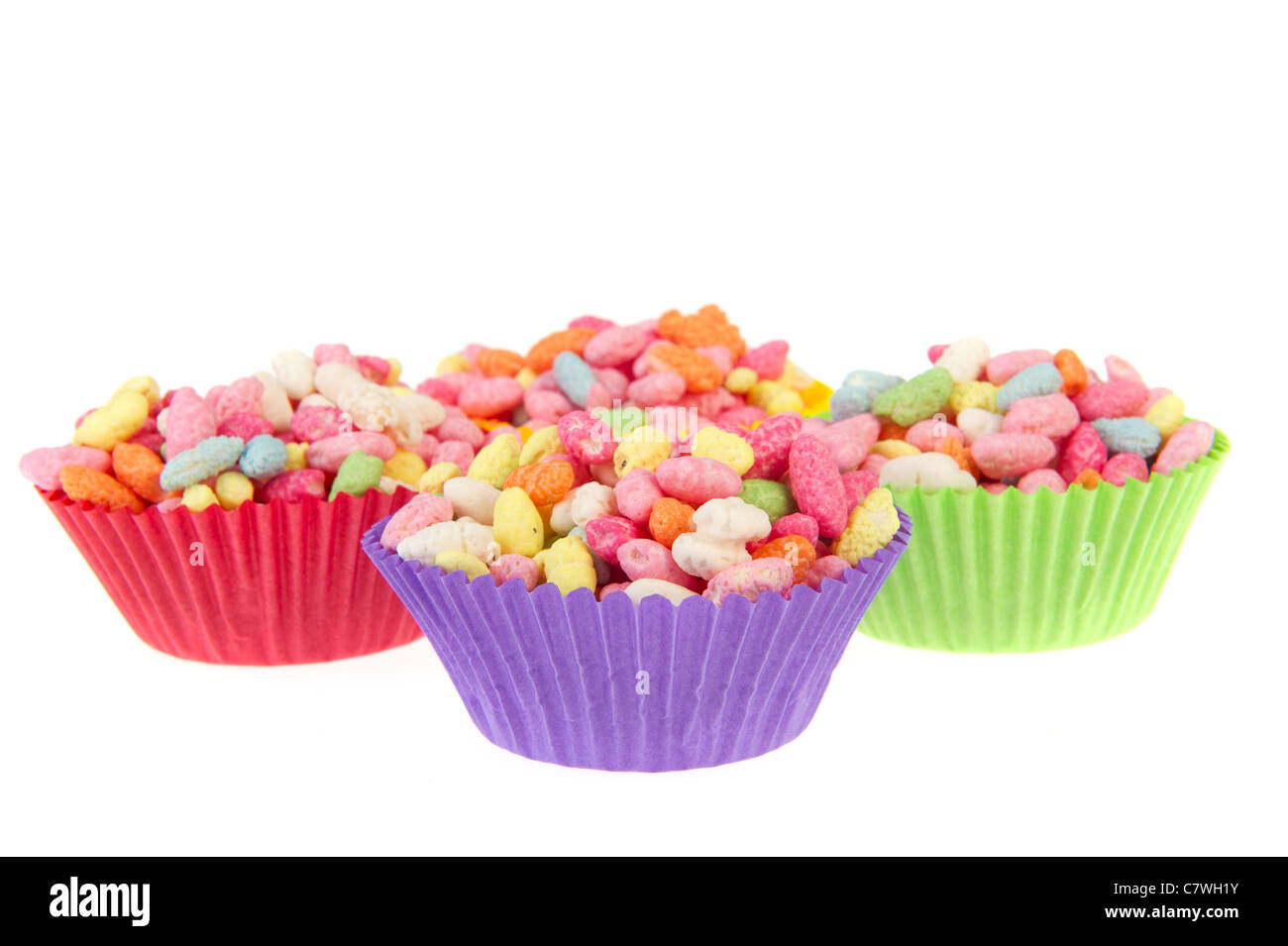 Colorful sweets in cups isolated over white background Stock Photo - Alamy