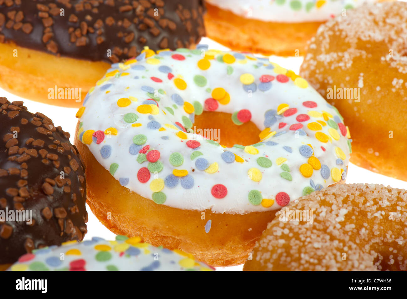 Colorful donuts with confetti and glaze in studio Stock Photo - Alamy