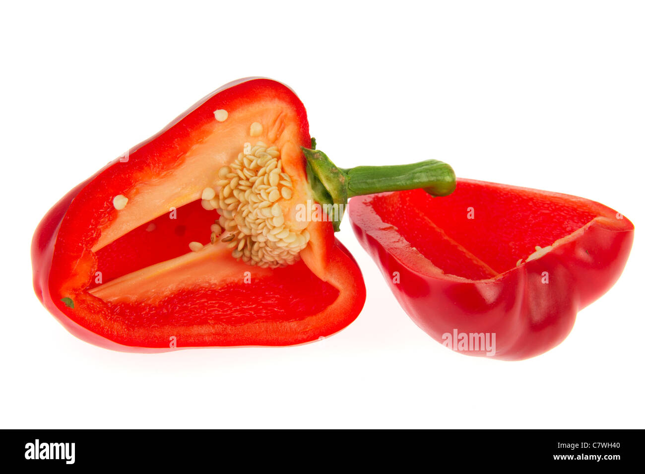 Open cut red paprika on white background Stock Photo - Alamy