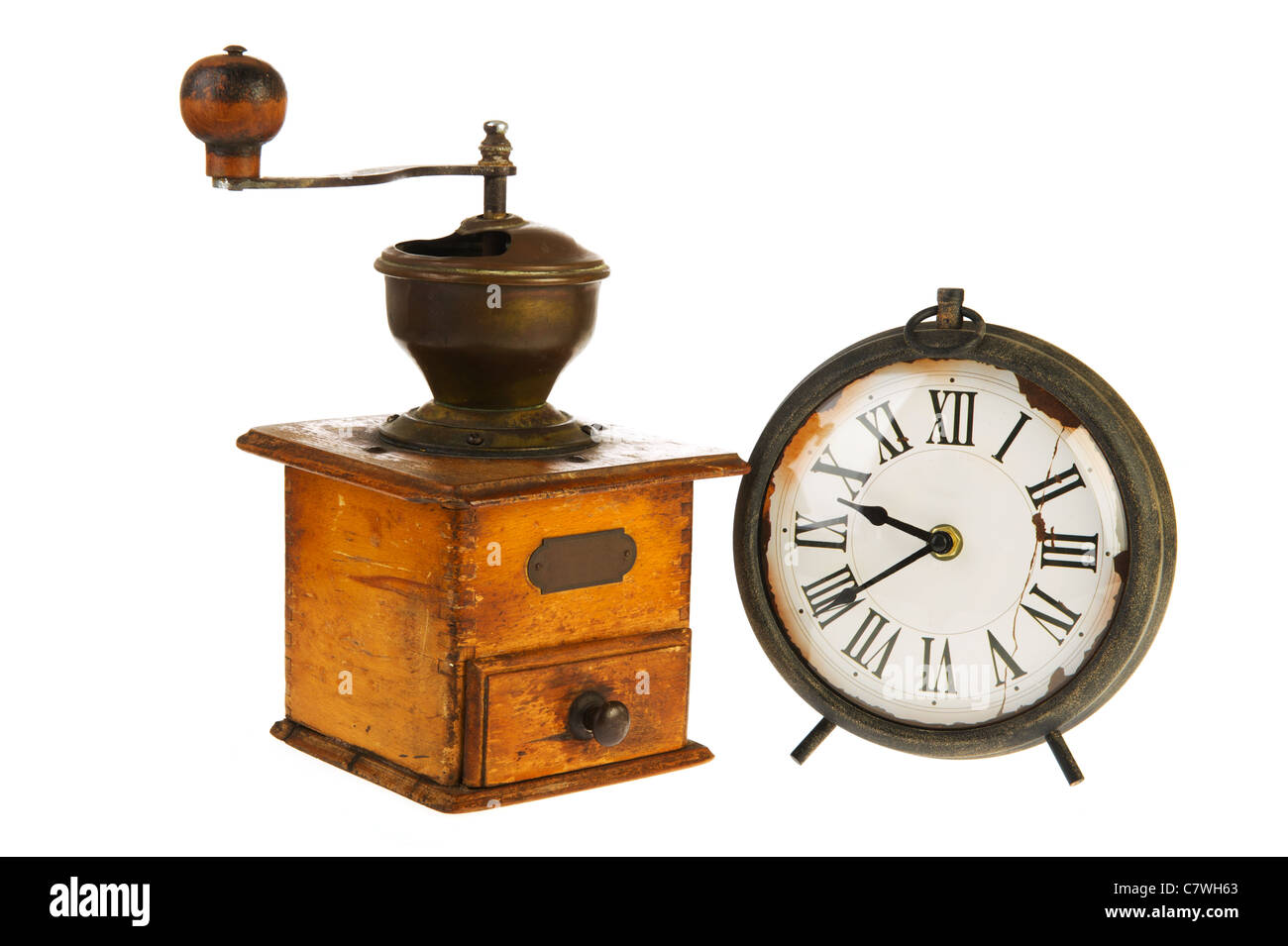 Nostalgic times with coffee grinder and old clock Stock Photo - Alamy