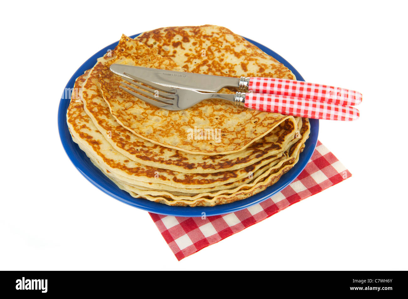 Plate with stack of pancakes and fork and knife Stock Photo - Alamy