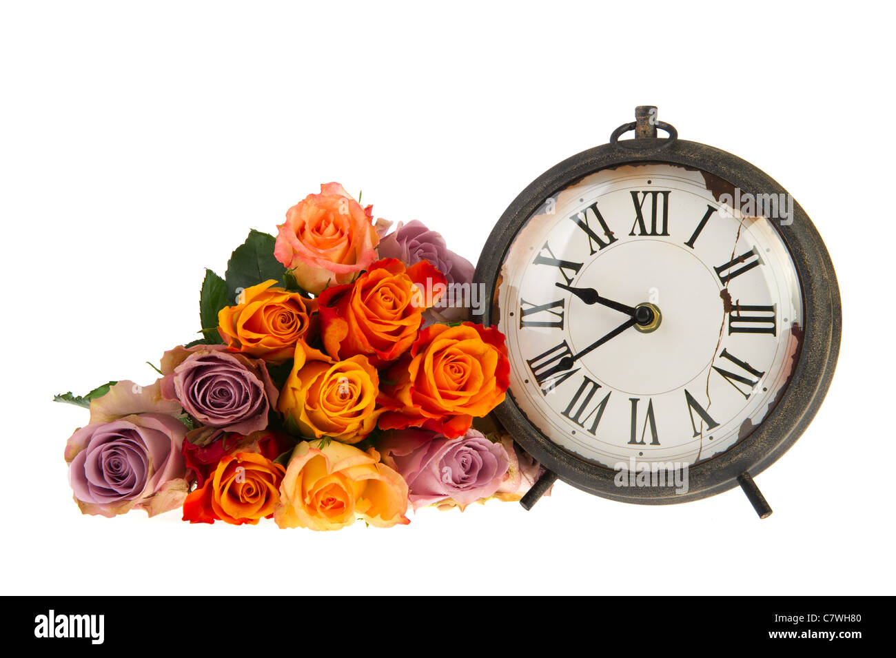 Romantic times with old antique clock and roses Stock Photo - Alamy