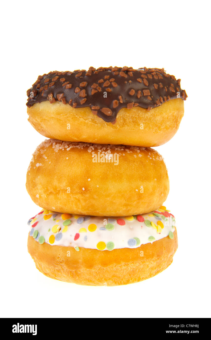 Three sugary sweet donuts with glaze isolated over white background ...