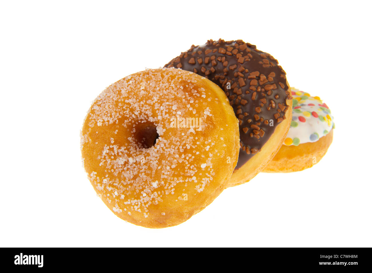 Three sugary sweet donuts with glaze isolated over white background ...