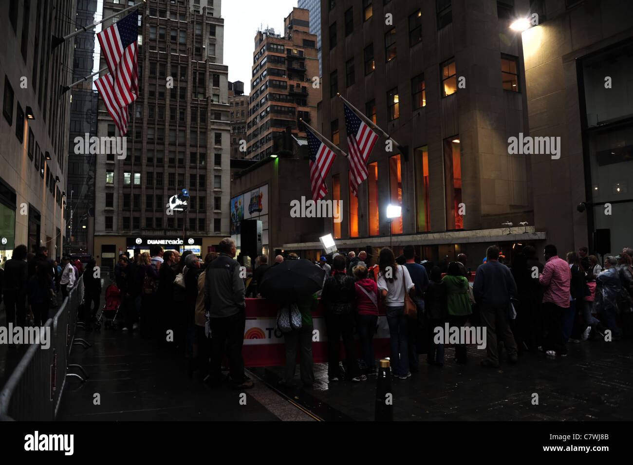 Early morning crowd watching 'Today Show' below American Flags, NBC ...
