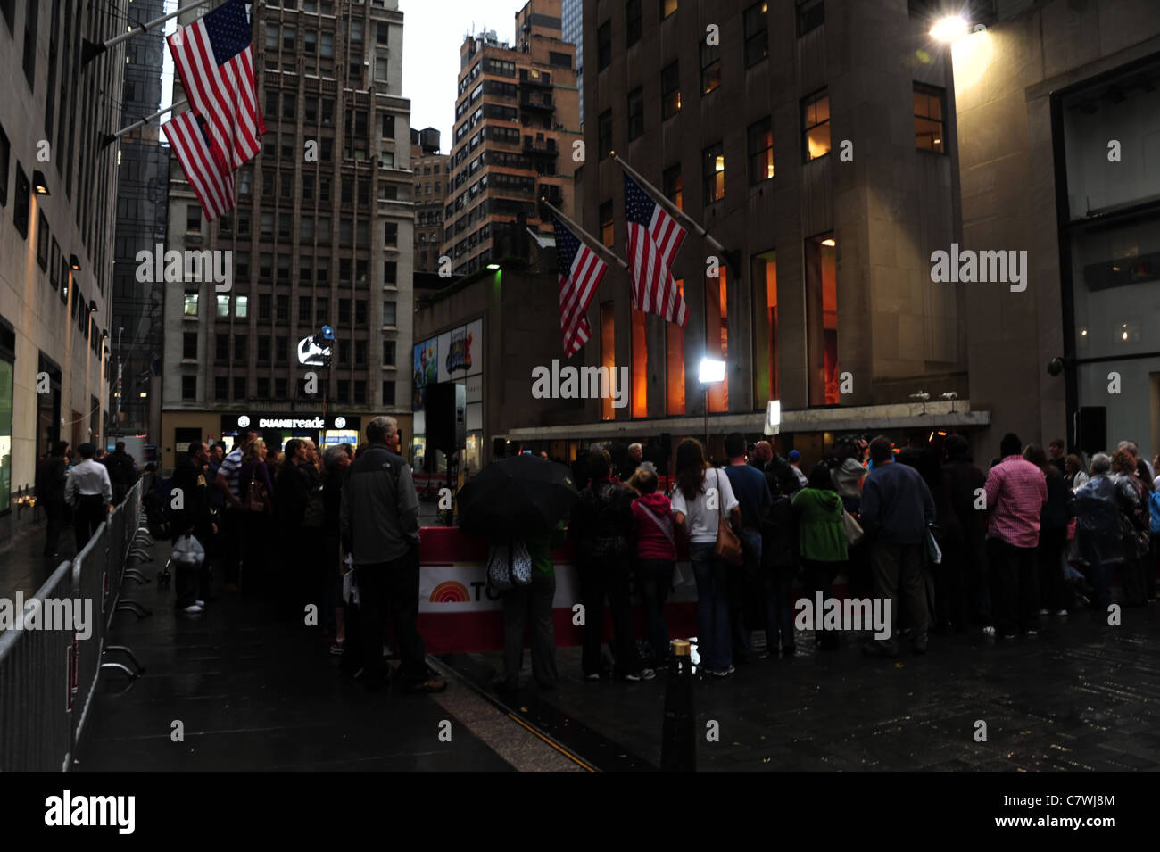 Early morning crowd watching 'Today Show' below American Flags, NBC ...