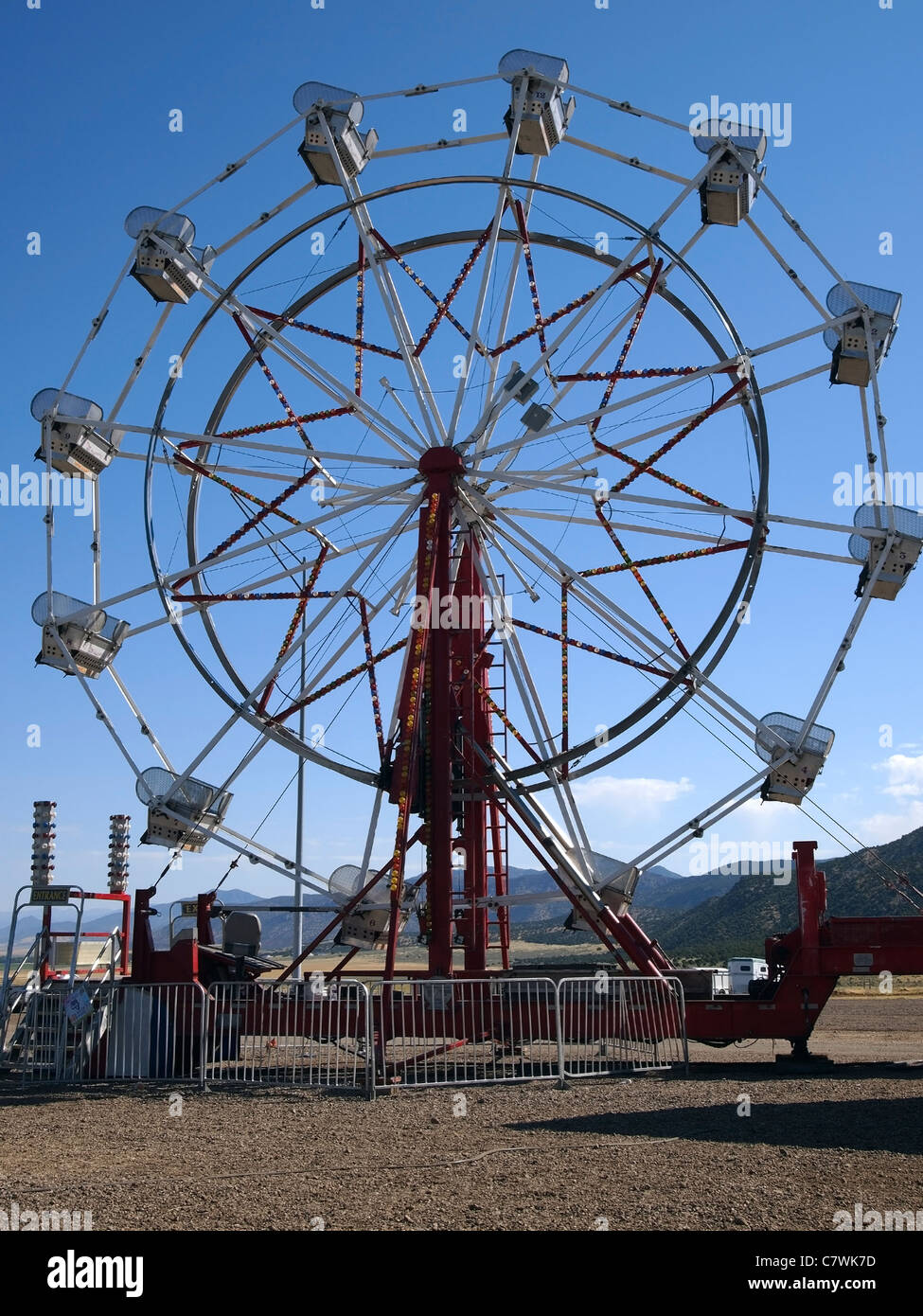A ferris wheel stands empty at a country carnival Stock Photo - Alamy