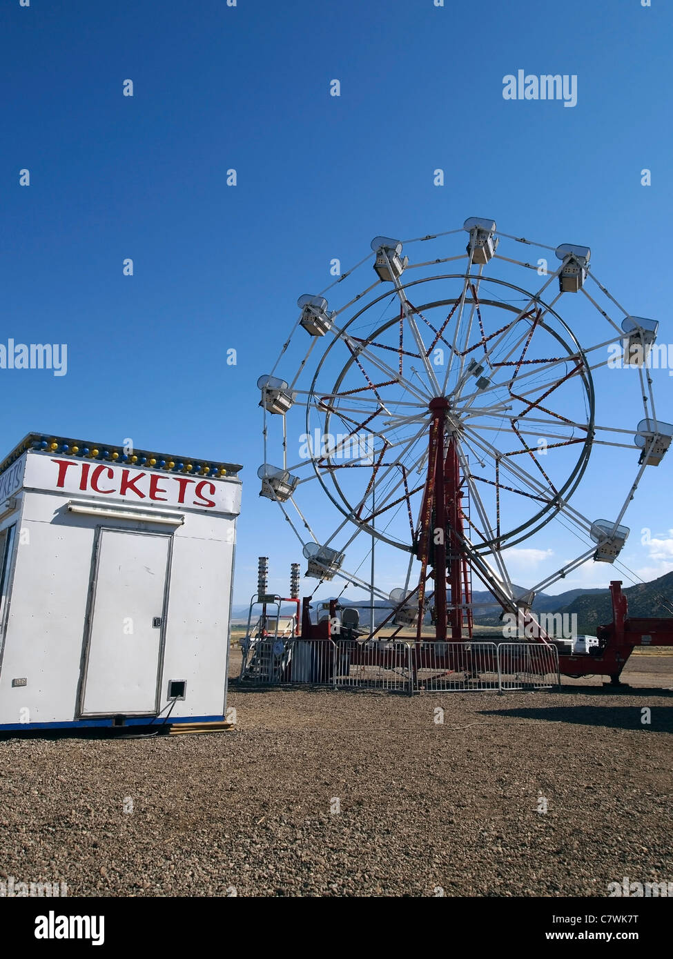 A ferris wheel stands empty at a country carnival Stock Photo - Alamy