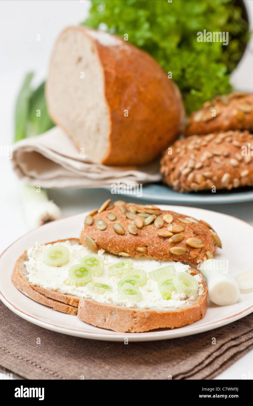 Breakfast with brown bread, cream cheese and spring onions Stock Photo ...