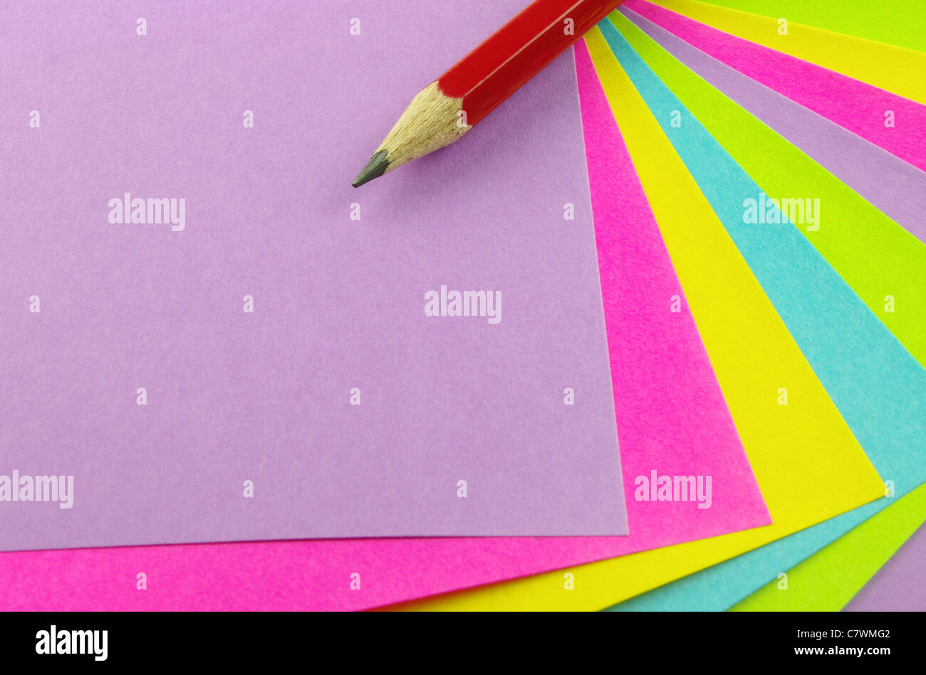 red pencil and coloured note paper Stock Photo - Alamy