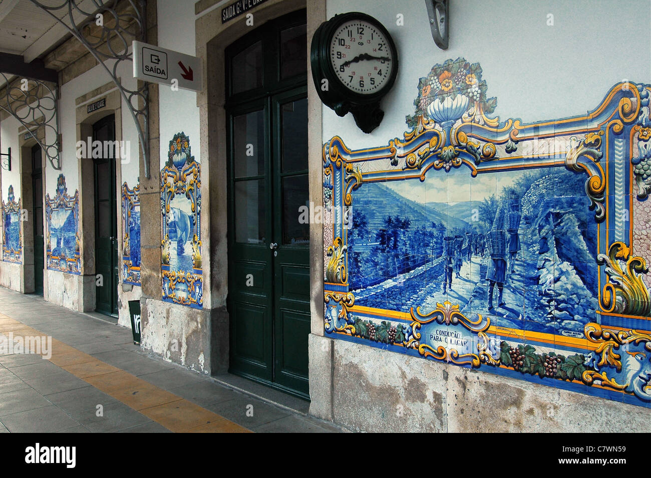 Figurative hand-painted azulejos tiles depicting scenes from the wine ...