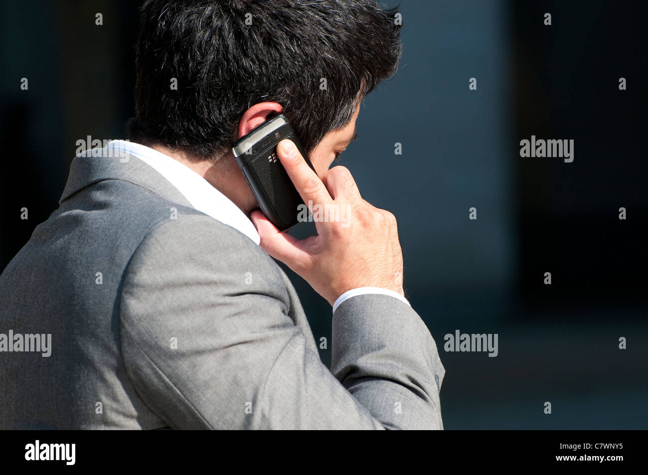 male office worker using mobile phone Stock Photo - Alamy