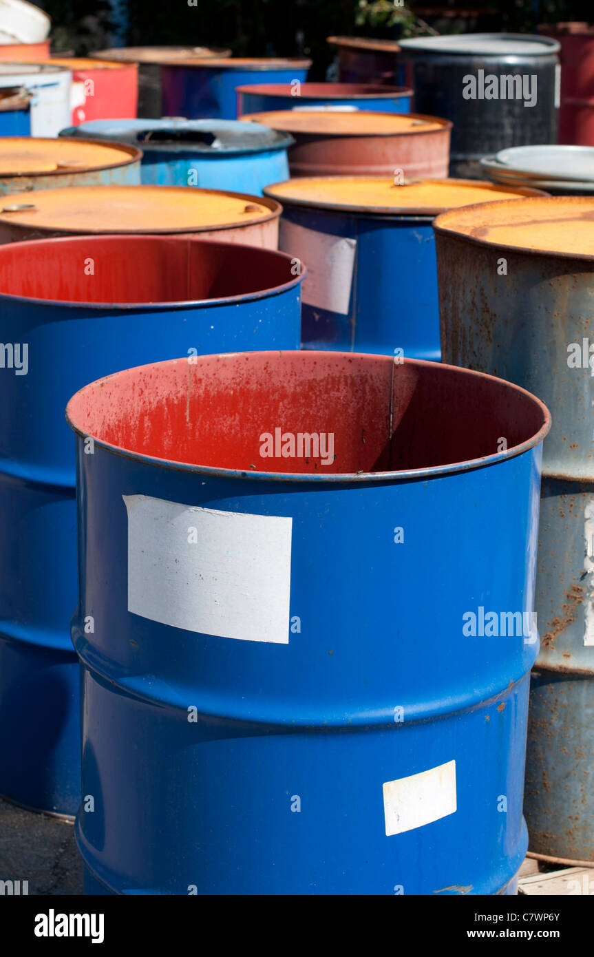 Old colored barrels for oil products. Empty rusted drums Stock Photo ...