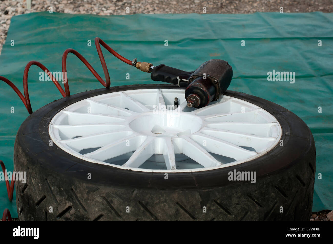 Changing a racing tire Stock Photo - Alamy