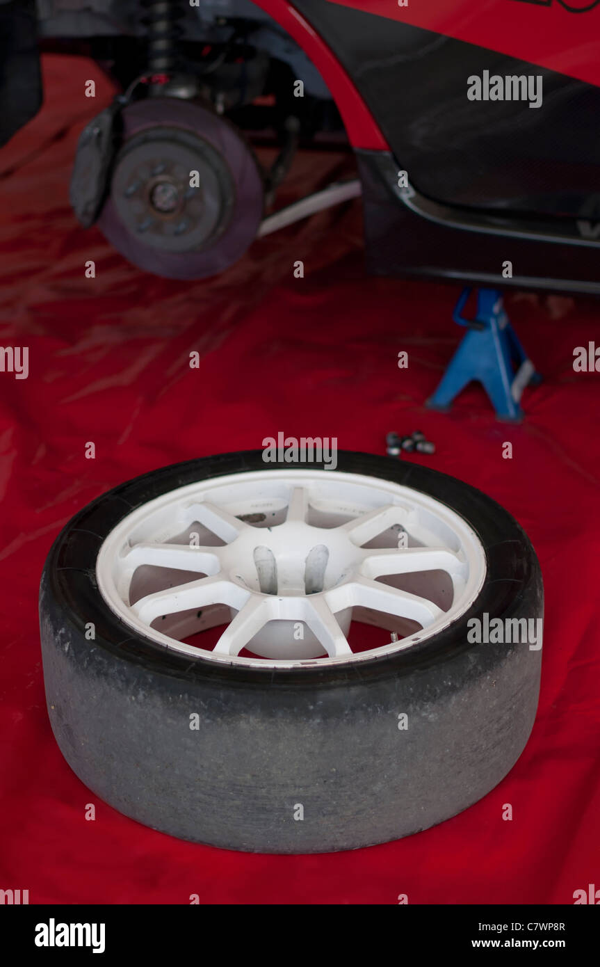Changing a racing tire Stock Photo - Alamy