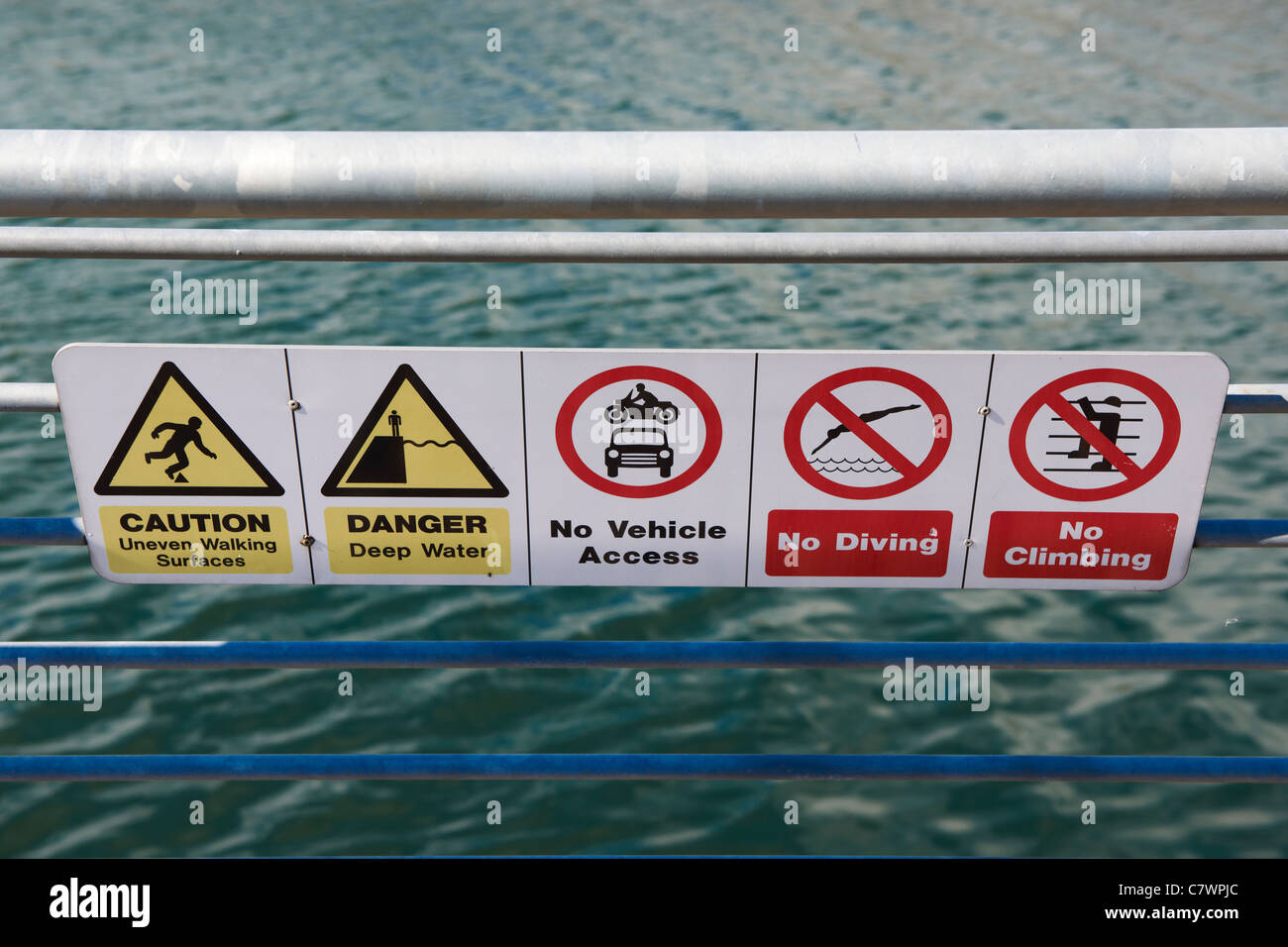 Sign with many differnt warnings Stock Photo - Alamy