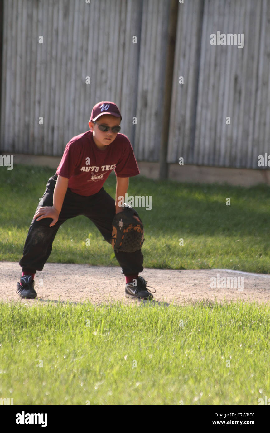 Baseball player on field at first base in down and ready position Stock ...