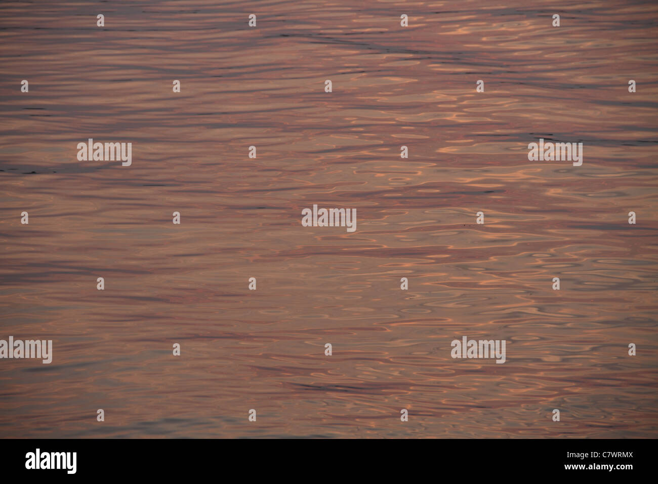 ocean red from sunset shining on water Stock Photo - Alamy