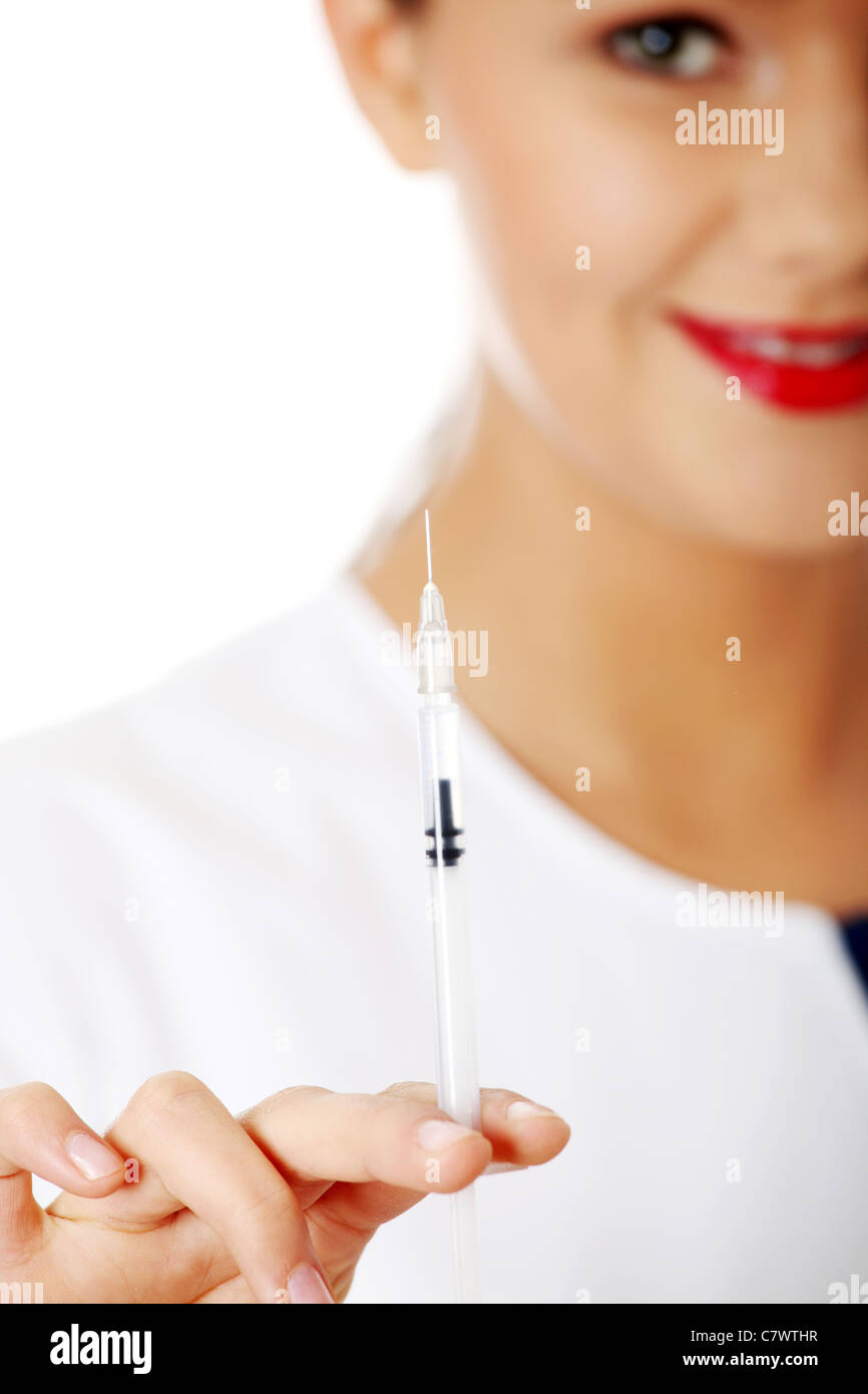 Young happy female doctor or nurse holding syringe Stock Photo - Alamy