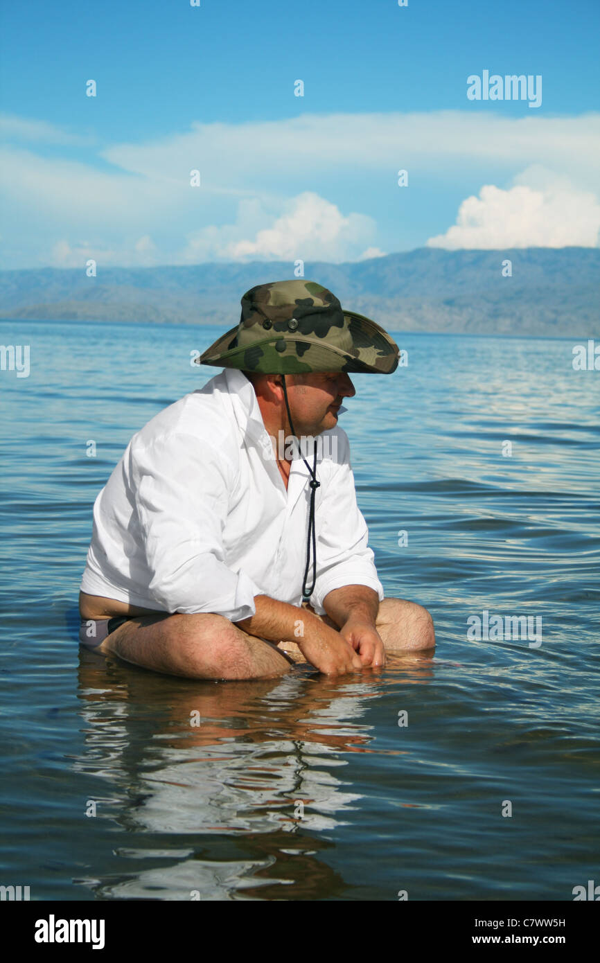 Contemplation Men resting in Water and smile Stock Photo - Alamy