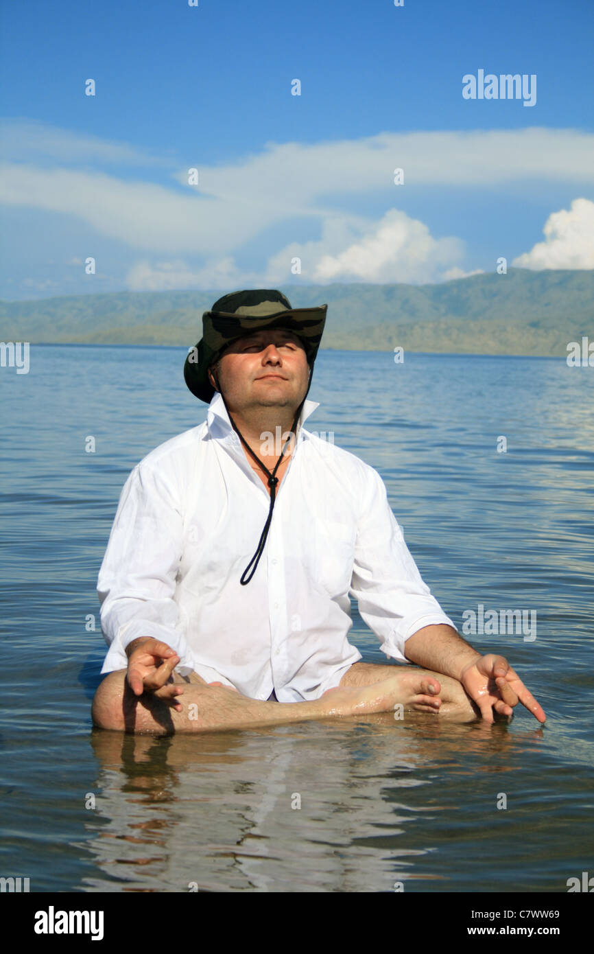 Contemplation Men resting in Water and smile Stock Photo - Alamy