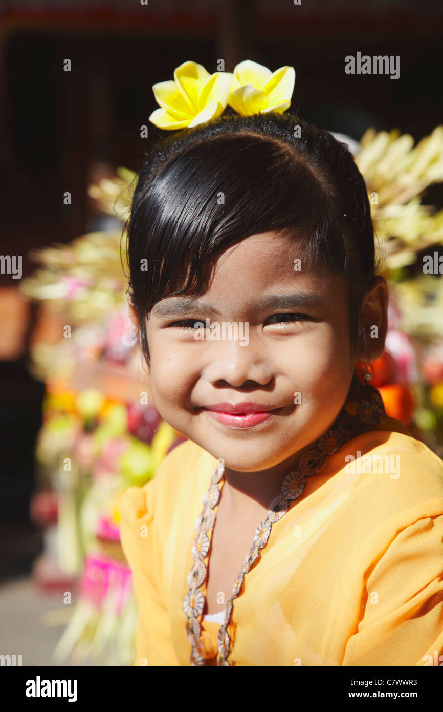 Girl wearing traditional clothing at temple ceremony, Bali, Indonesia ...