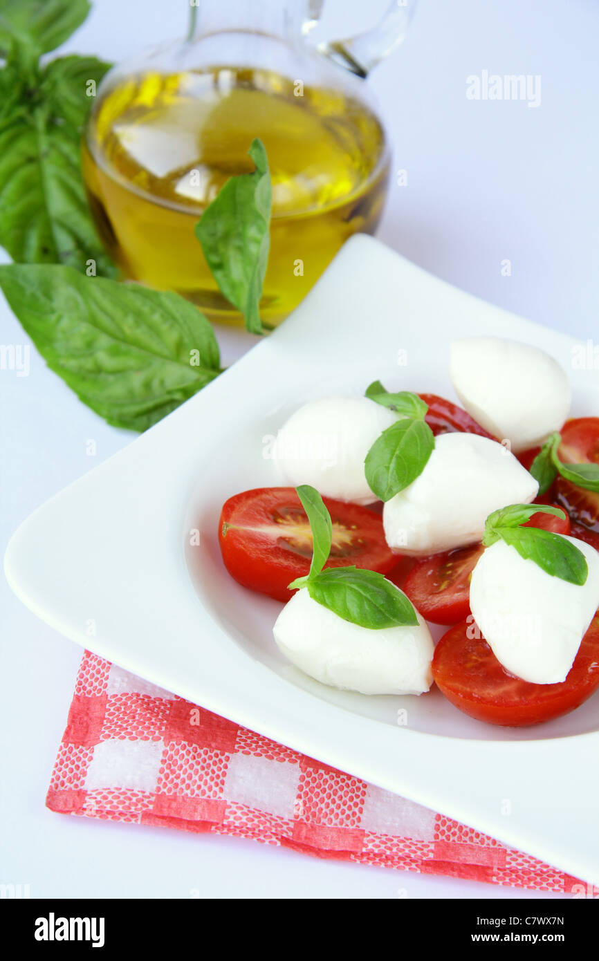 Baby mozzarella and tomato Stock Photo - Alamy
