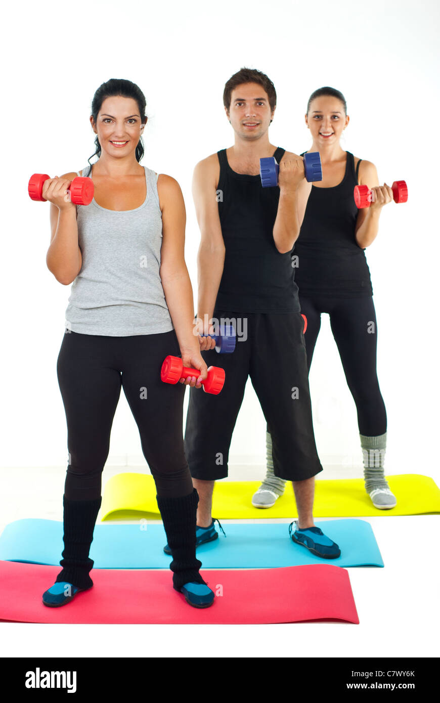 Full length of happy team of people doing fitness and working with ...