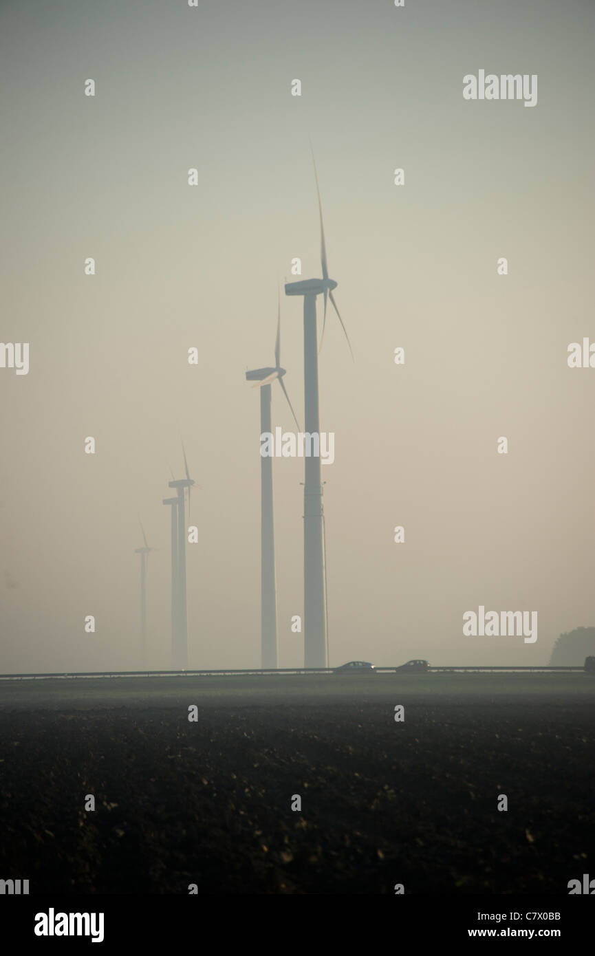 Wind turbines in the mist Stock Photo - Alamy