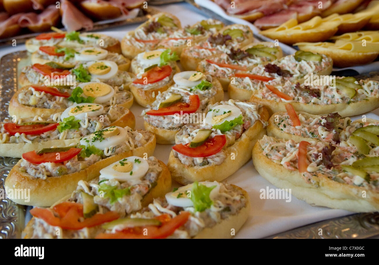 Bread toast for lunch with salad dressing laid out on table Stock Photo ...