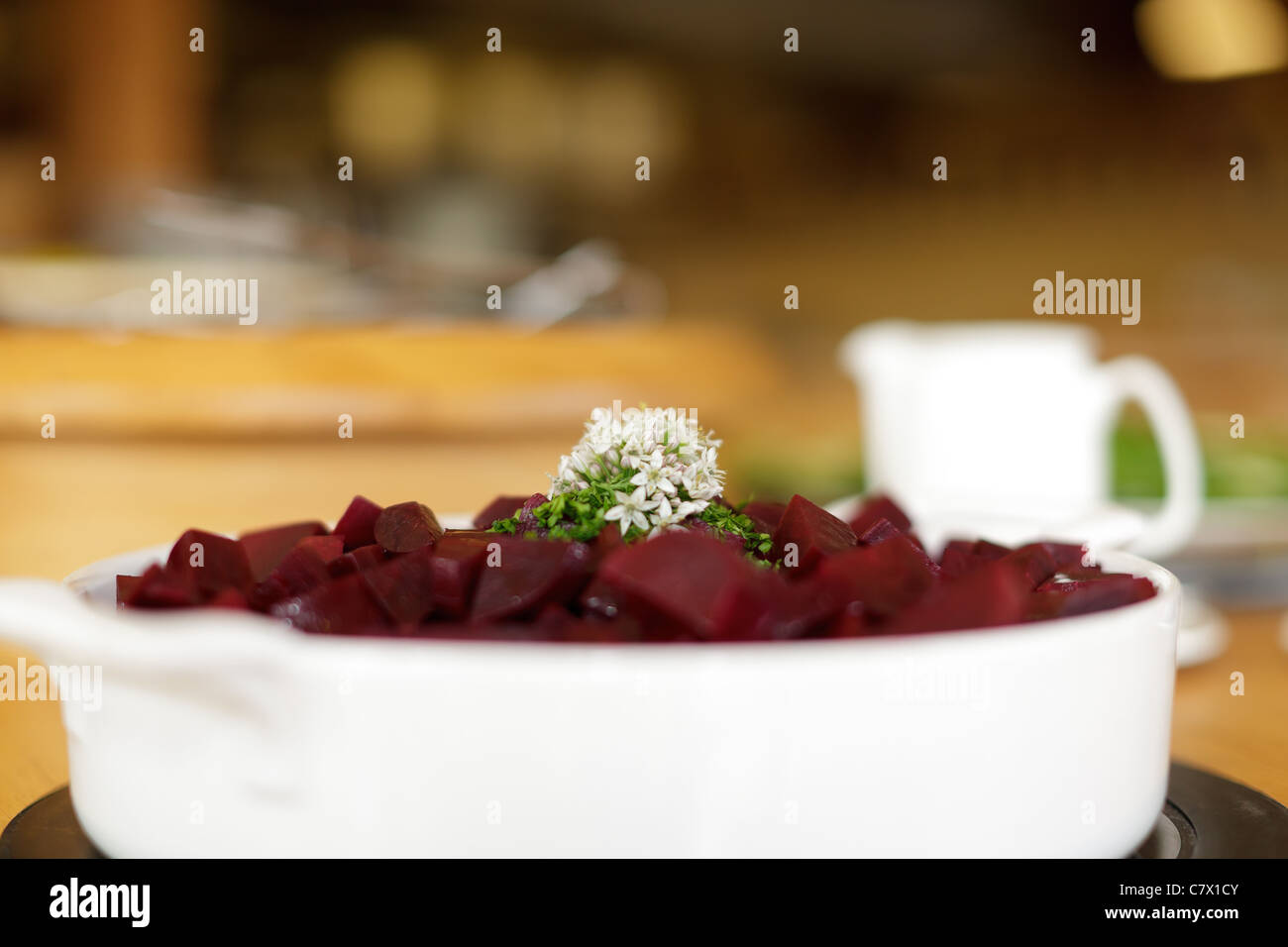 Chopped beetroot with edible flowers Stock Photo - Alamy