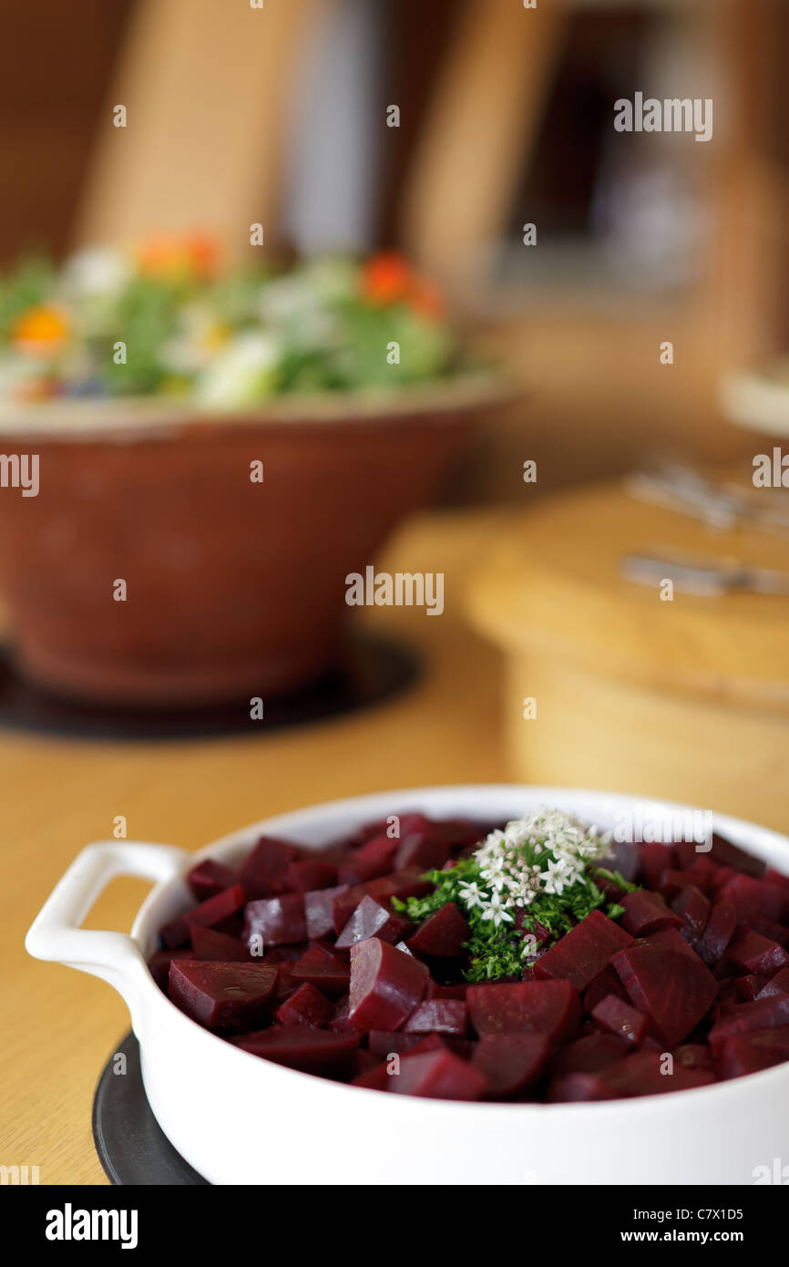 Chopped beetroot with edible flowers Stock Photo - Alamy