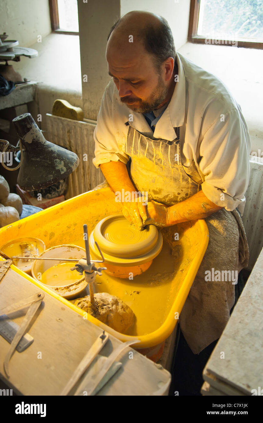 A potter at work in the Wensleydale Pottery in Hawes in Wensleydale in ...